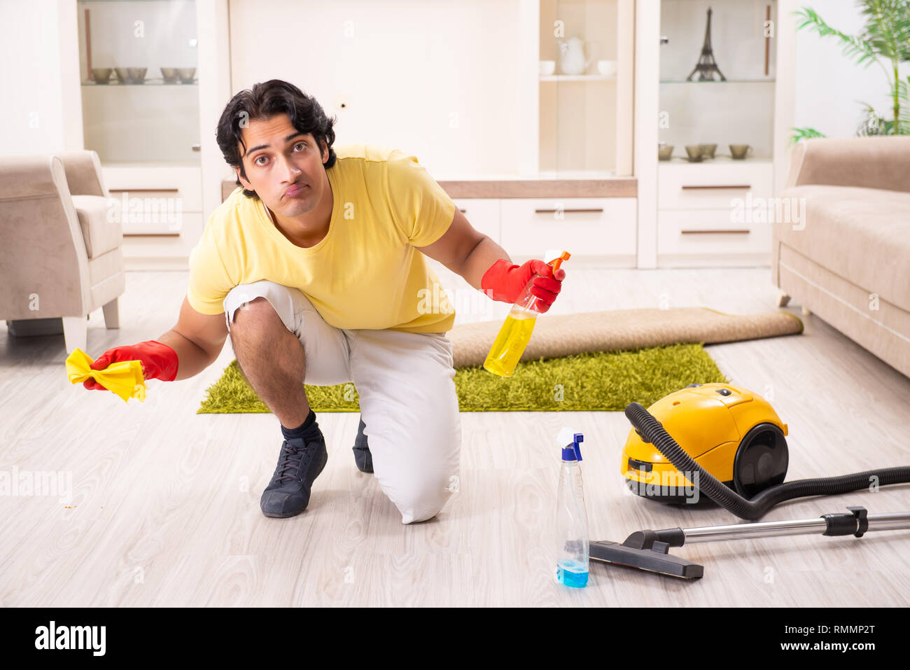 Young handsome man doing housework Stock Photo - Alamy