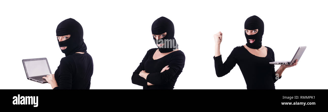 Hacker with computer wearing balaclava Stock Photo - Alamy