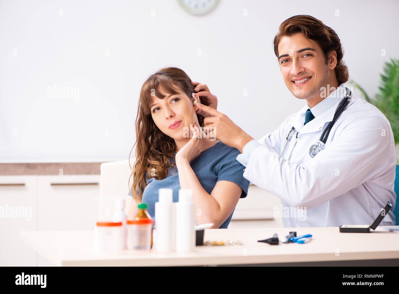 Patient with hearing problem visiting doctor otorhinolaryngologist Stock Photo - Alamy