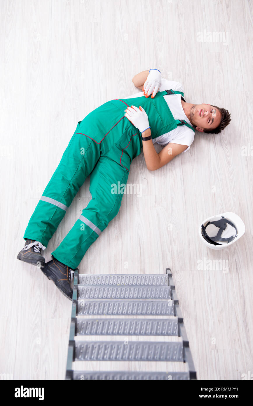 Young worker falling from the ladder Stock Photo - Alamy