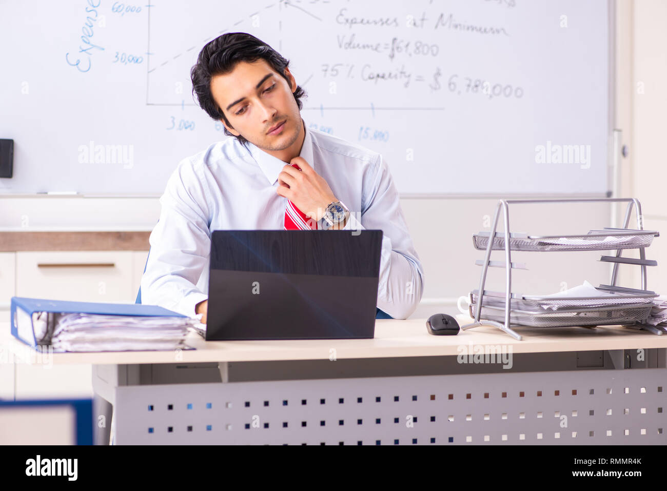 Male sales analyst in front of the whiteboard Stock Photo - Alamy
