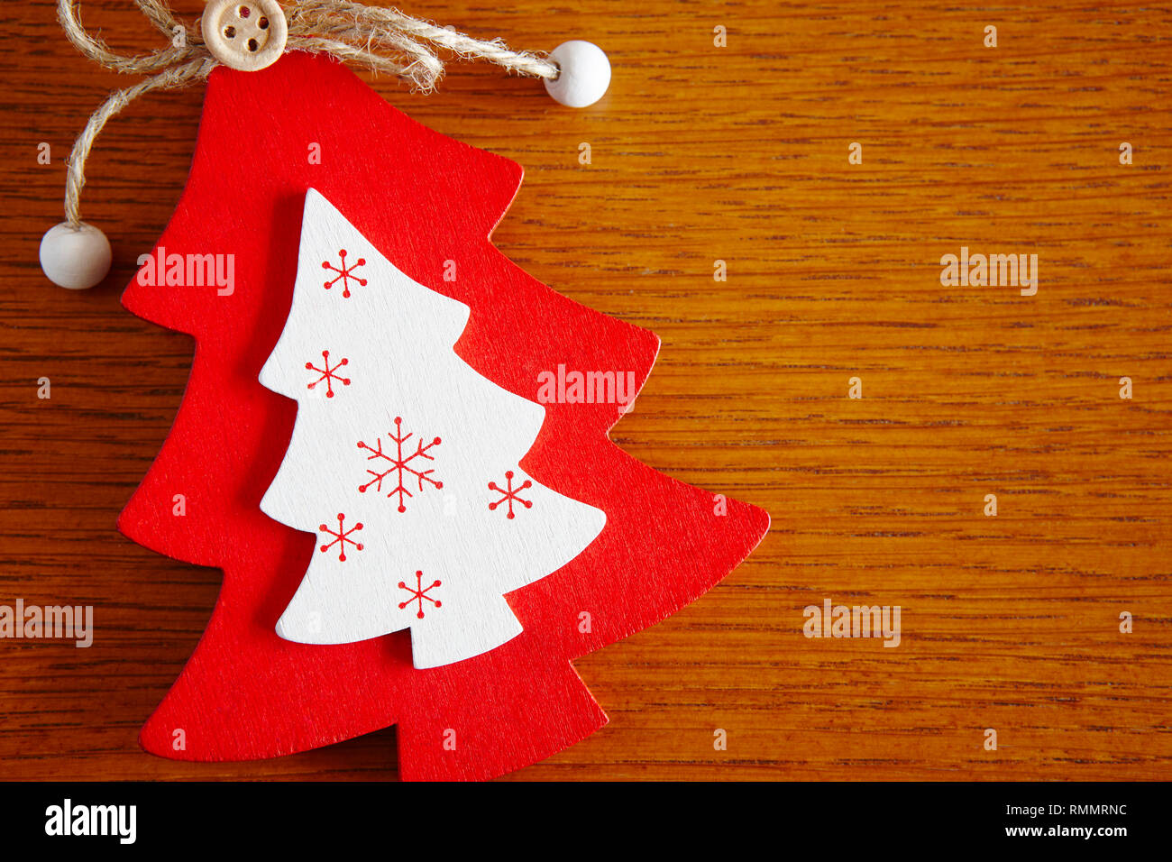 Christmas handmade wooden tree figures in red and white color ...