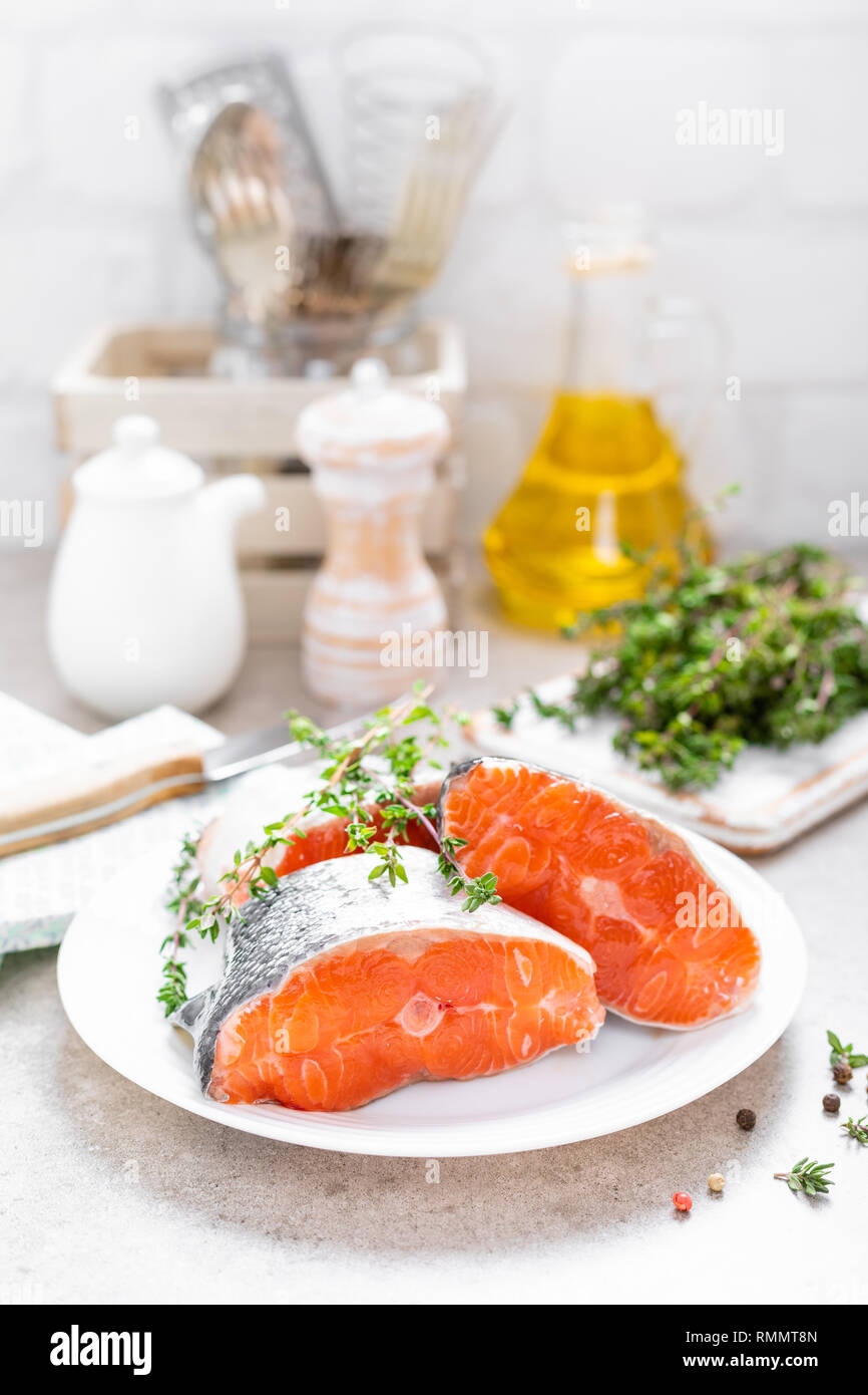 Fresh raw salmon fish steaks on white kitchen background Stock Photo ...