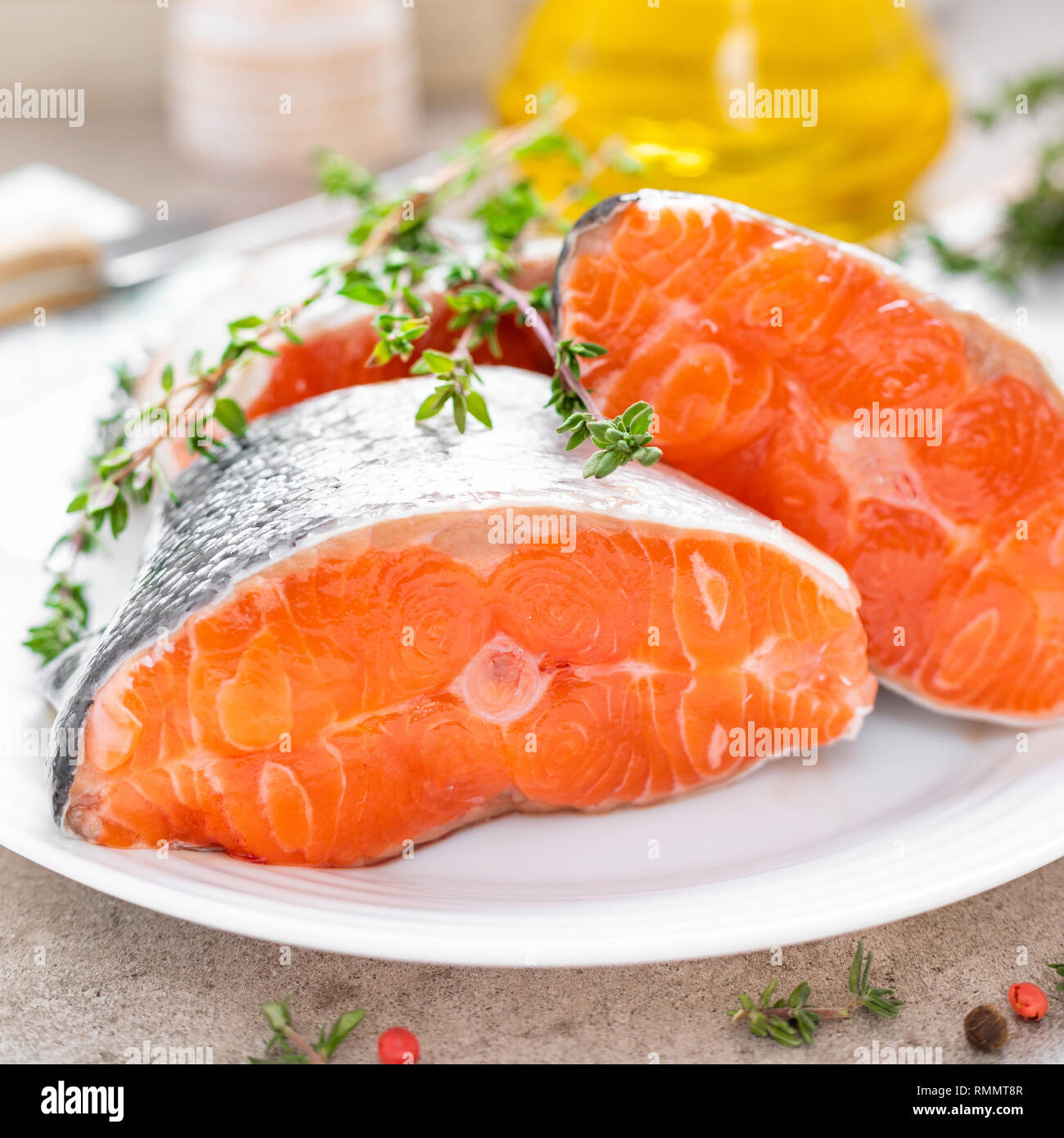 Fresh raw salmon fish steaks on white kitchen background Stock Photo ...