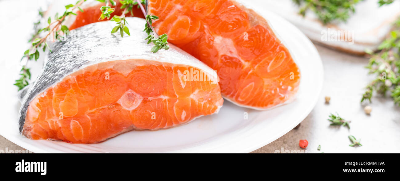 Fresh raw salmon fish steaks on white kitchen background. Banner Stock ...