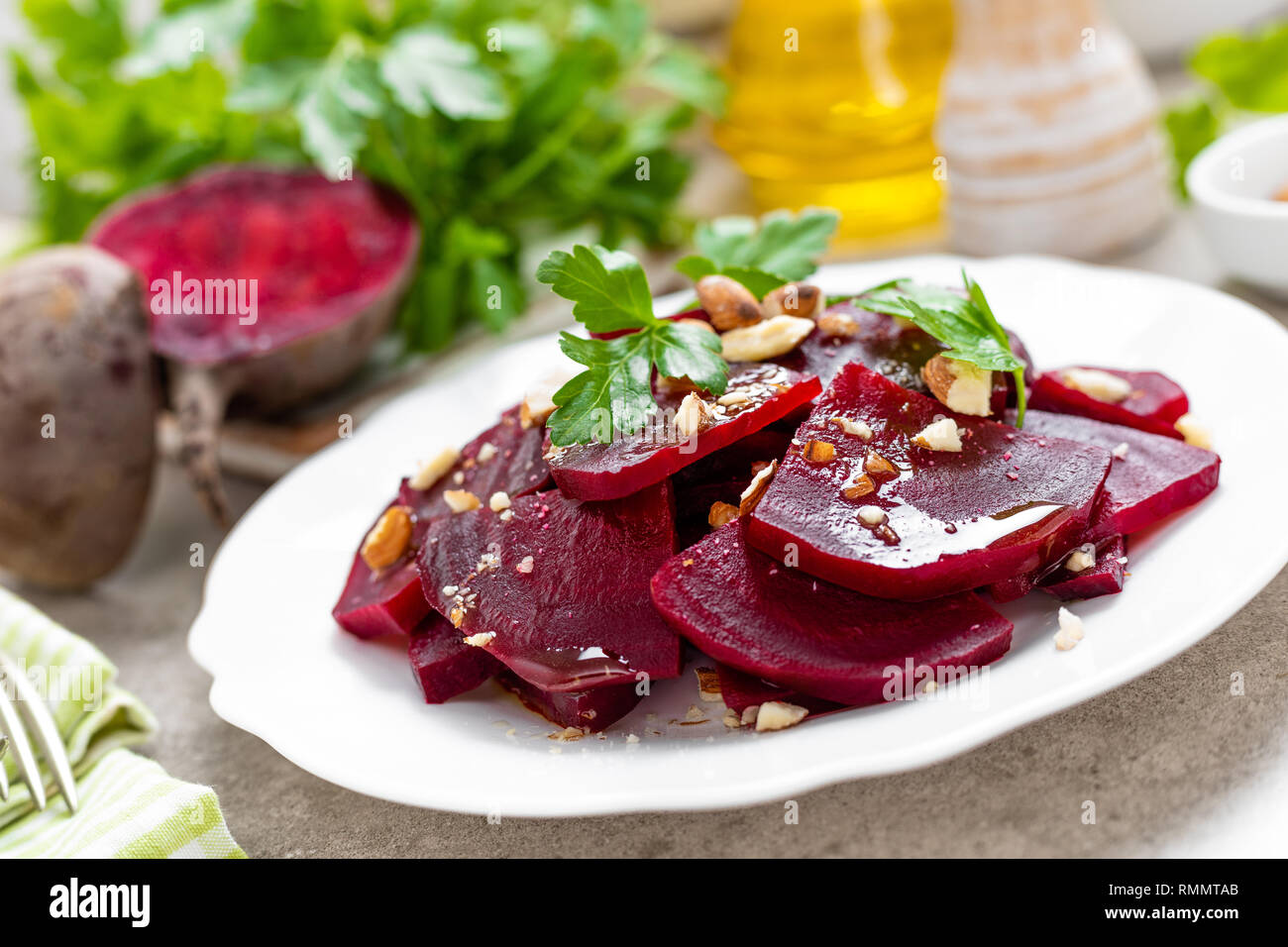 Vegetarian salad with boiled beet, almond nuts and oil. Healthy food ...