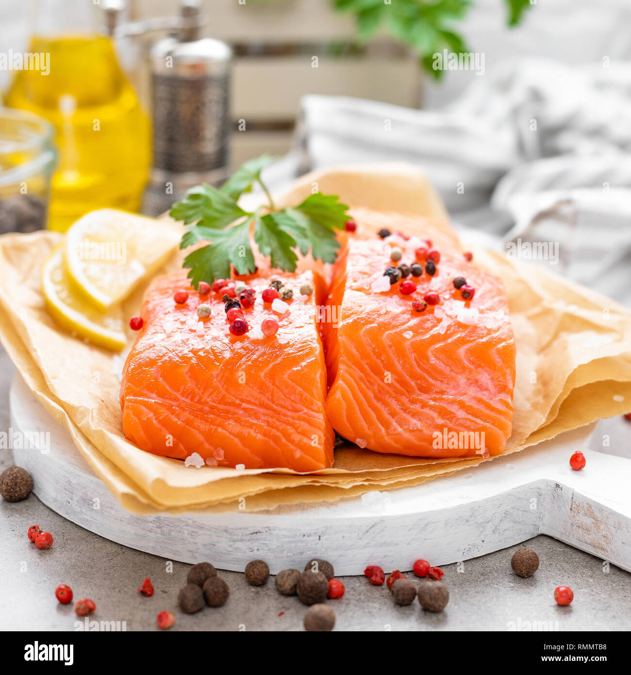 Fresh raw salmon fish fillet on white kitchen background Stock Photo ...