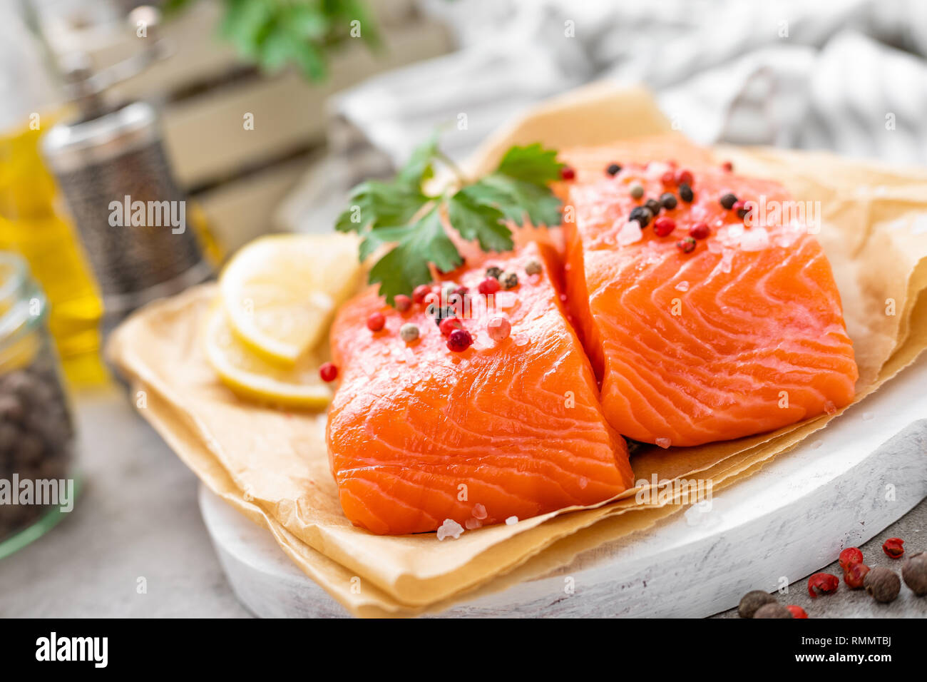 Fresh raw salmon fish fillet on white kitchen background Stock Photo ...