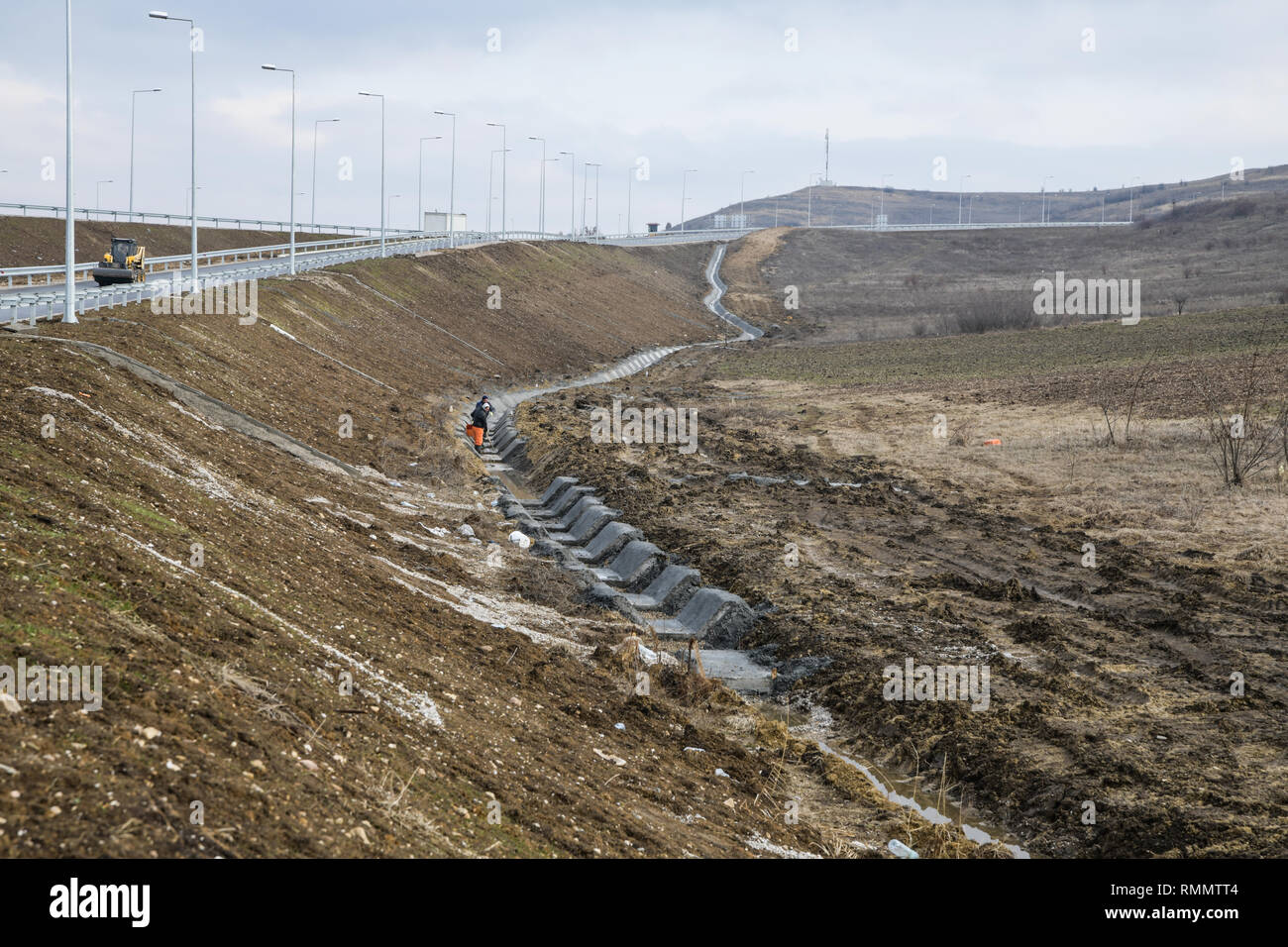 Drainage water channel along the highway Stock Photo - Alamy