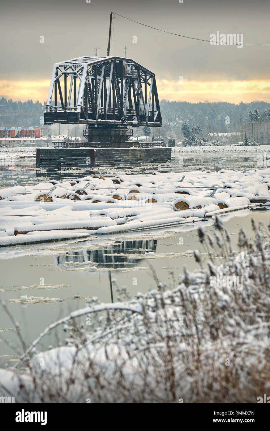 Open Rail Bridge, Icy River. Ice chunks flow under a railway bridge ...