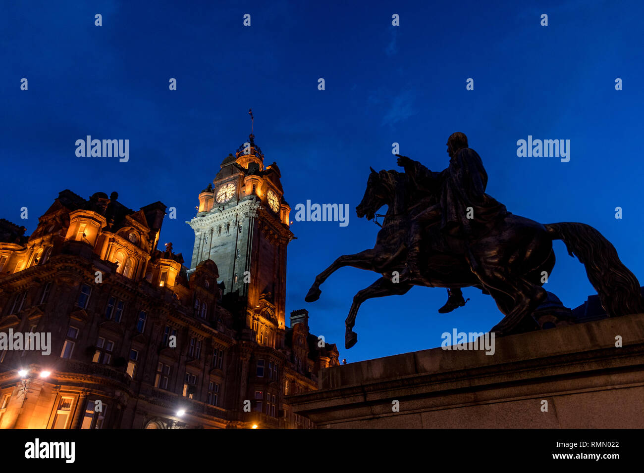 The Balmoral with rider statue at blue hour in Edinburgh Stock Photo ...