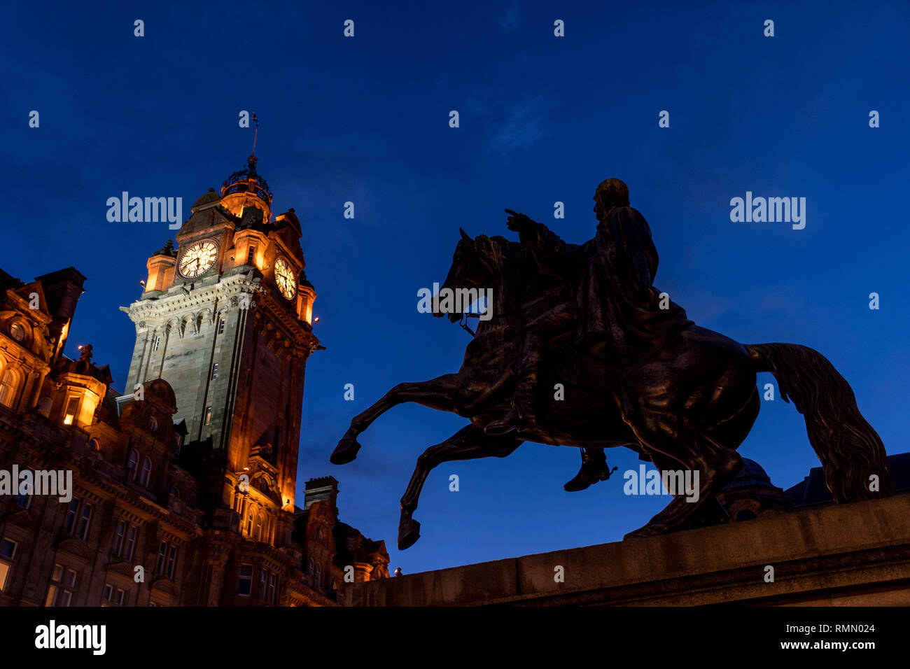 The Balmoral with rider statue at blue hour in Edinburgh Stock Photo ...