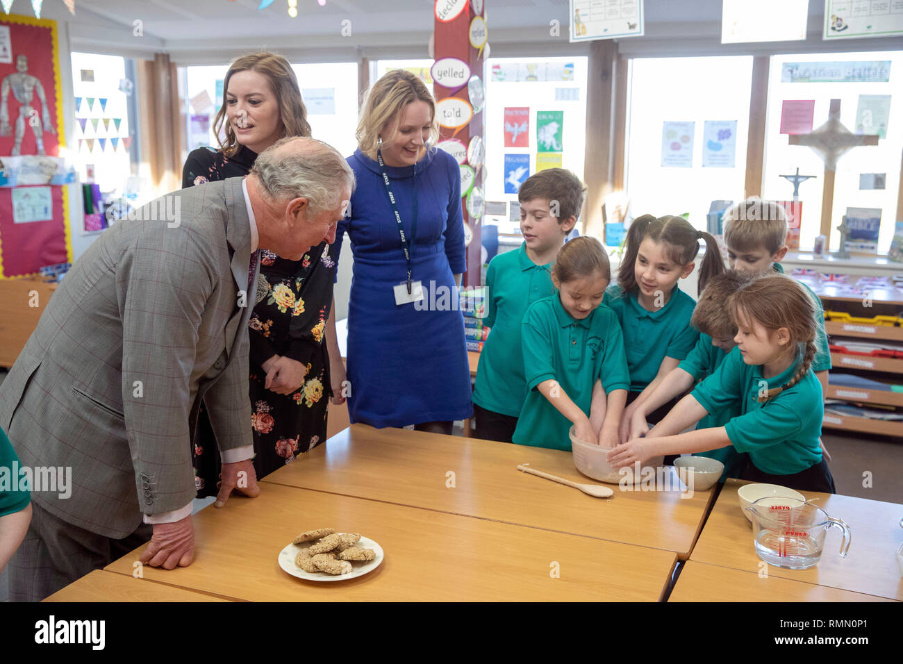 The Prince of Wales talks to school children during a visit to ...