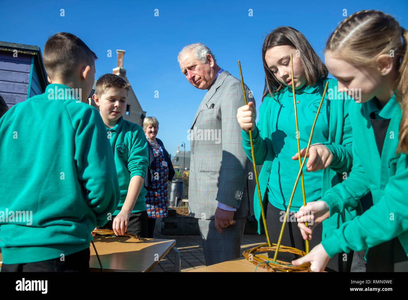 The Prince of Wales talks to school children during a visit to ...