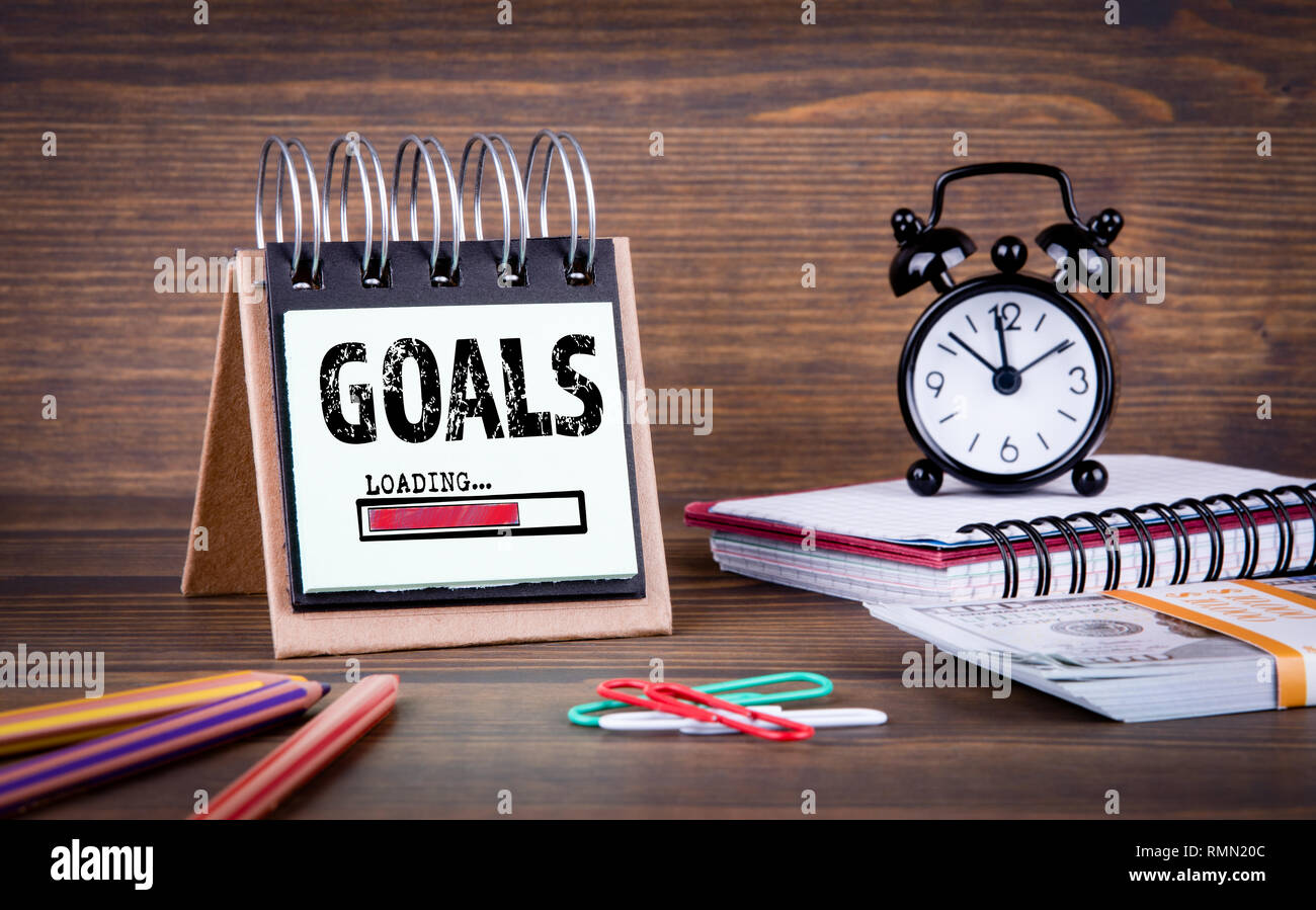 Goals loading concept. Wooden office table Stock Photo - Alamy