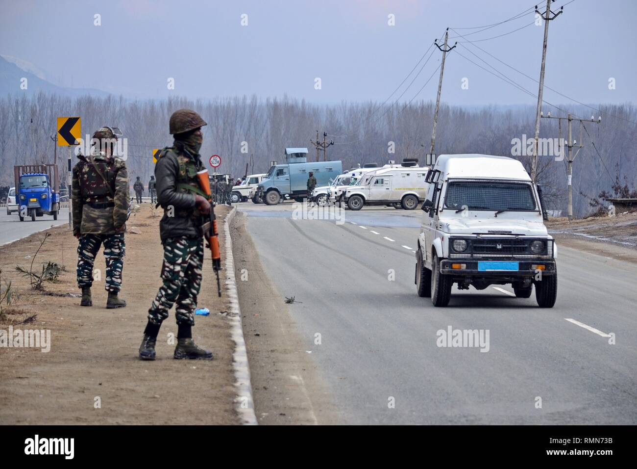Paramilitary troopers seen keeping vigil as a police vehicle is seen ...