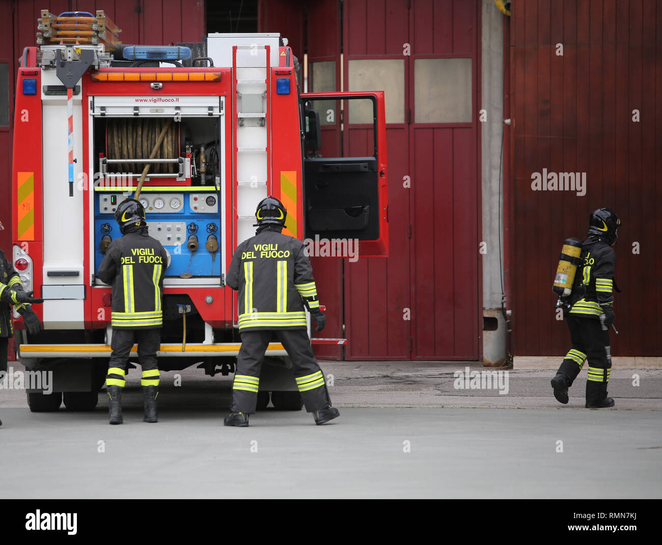Vicenza, VI, Italy - May 10, 2018: big fire truck and three talian ...