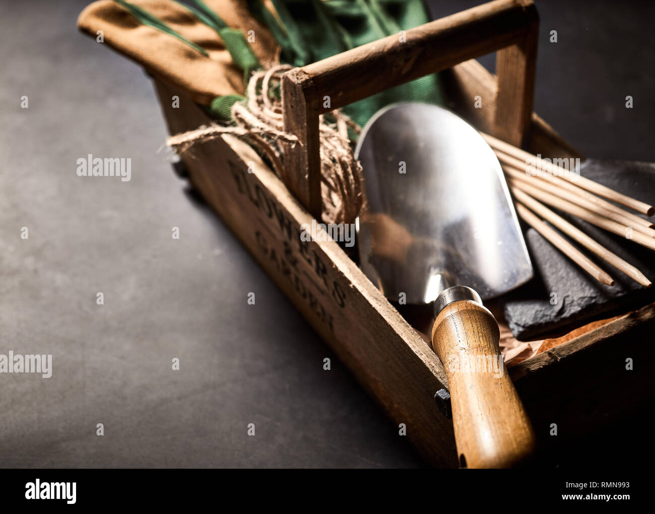 Gardening tools in wooden box in close up view Stock Photo - Alamy