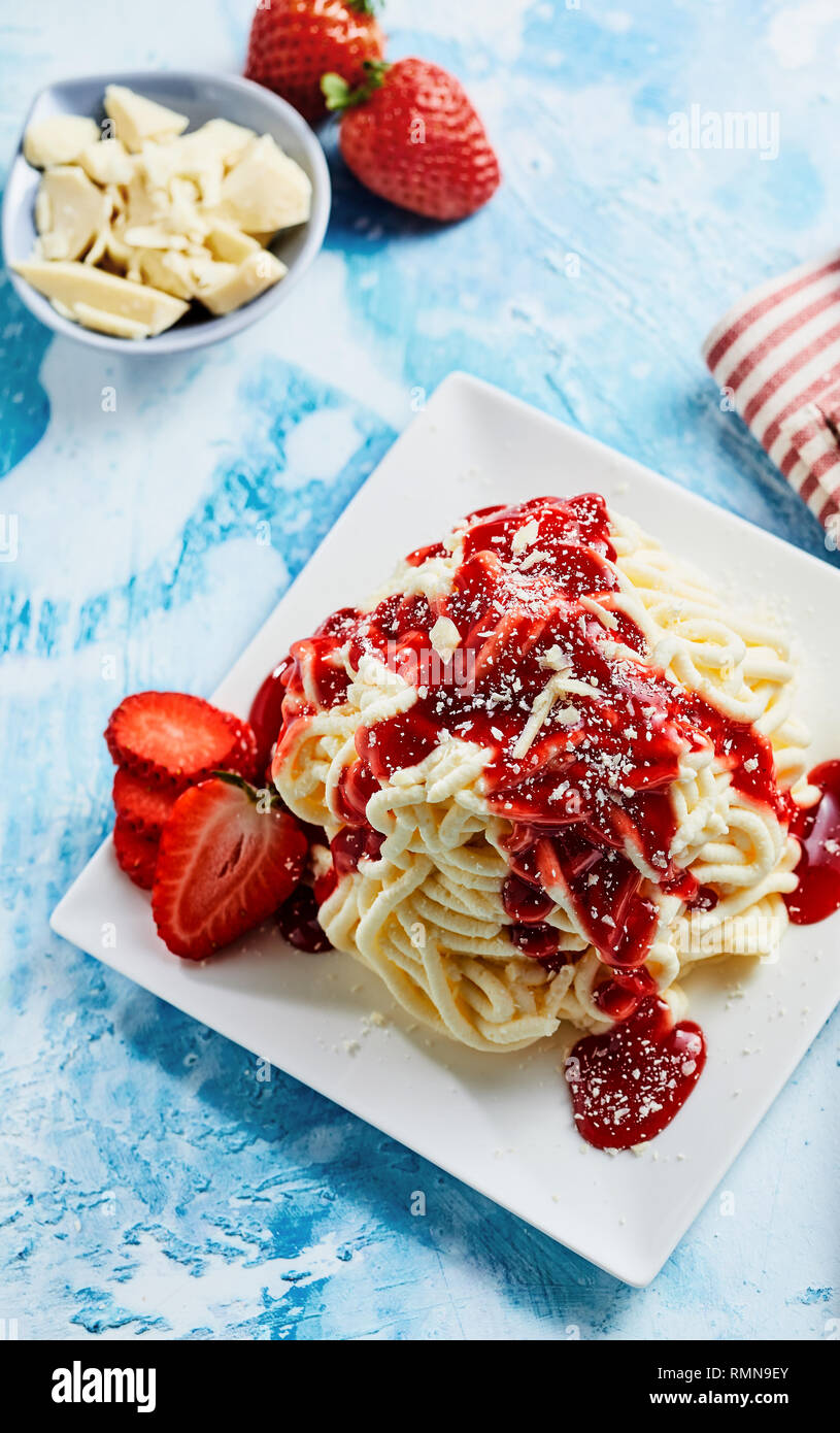 Spaghetti ice cream with strawberry sauce hi-res stock photography and ...