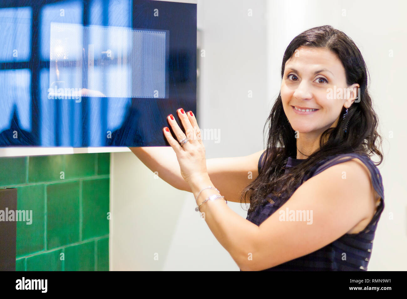 woman using microwave Stock Photo - Alamy