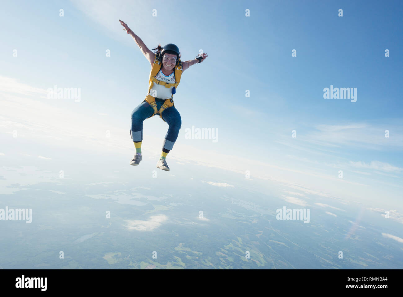 Back view of woman jumping hi-res stock photography and images - Alamy