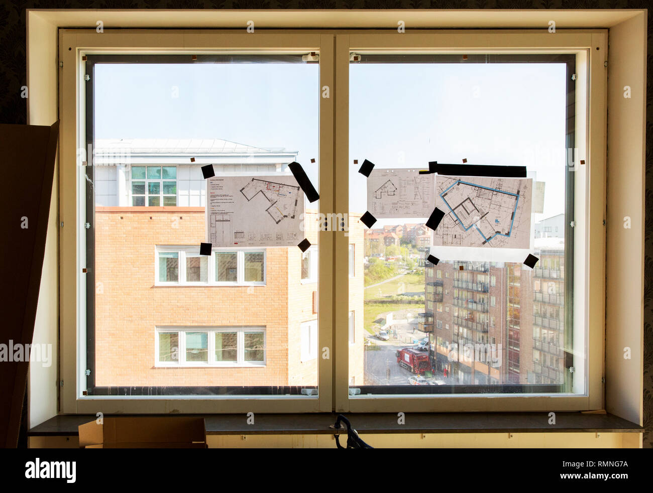 Blueprints on window Stock Photo - Alamy