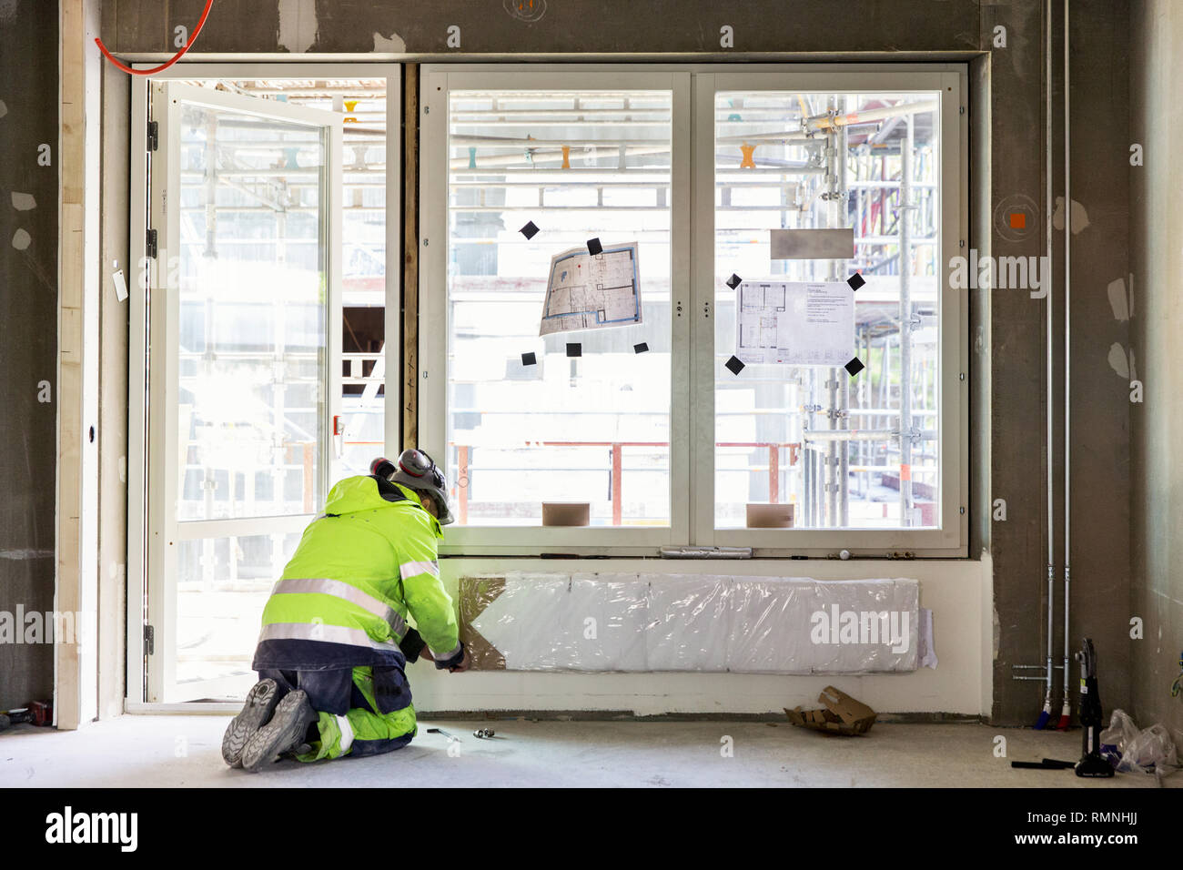 Builder at work Stock Photo - Alamy
