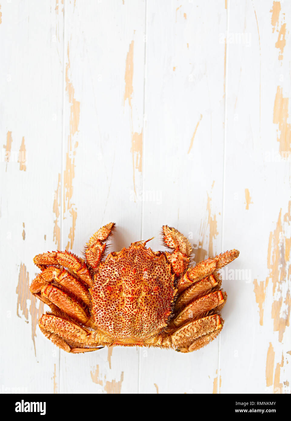 One freshly cooked crab on rustic white wooden table. Top view Stock ...