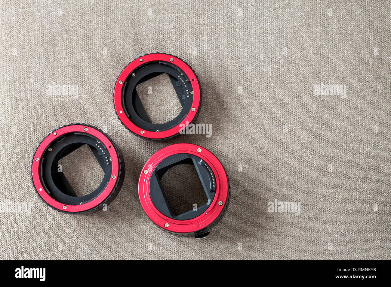 Close-up of macro rings, camera adapters on light cloth copy space ...