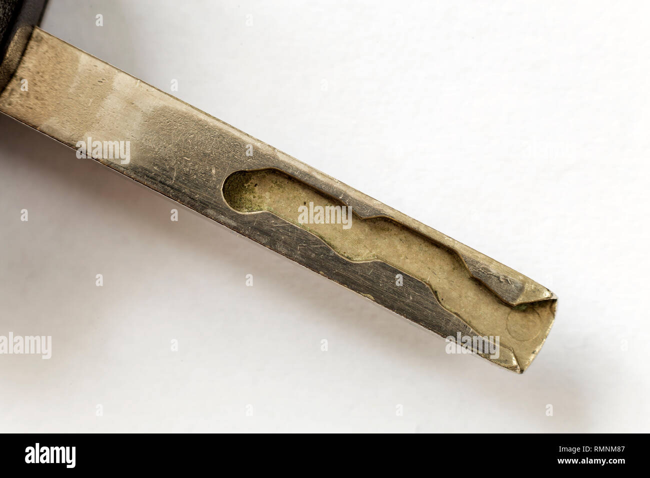 Close-up of car key detail on white copy space background. Vehicle lock ...
