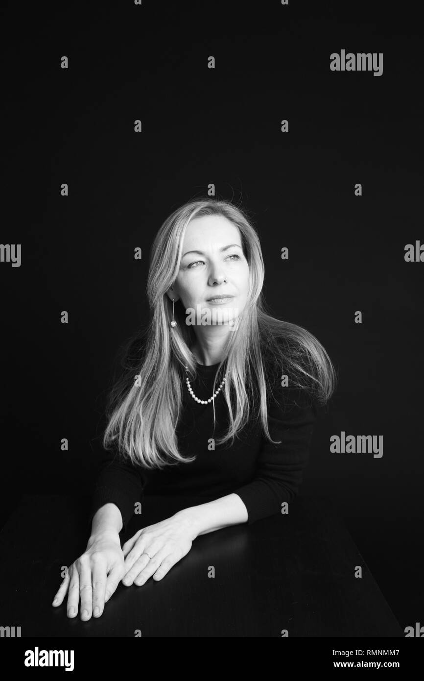Close up studio portrait of a beautiful woman in the black dress ...