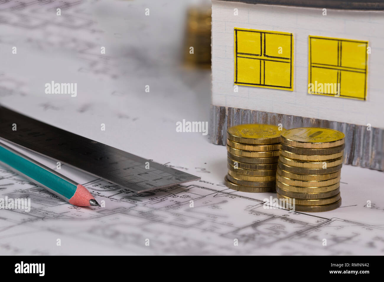 Coal pencil and metal ruler on a technical drawing of an apartment ...