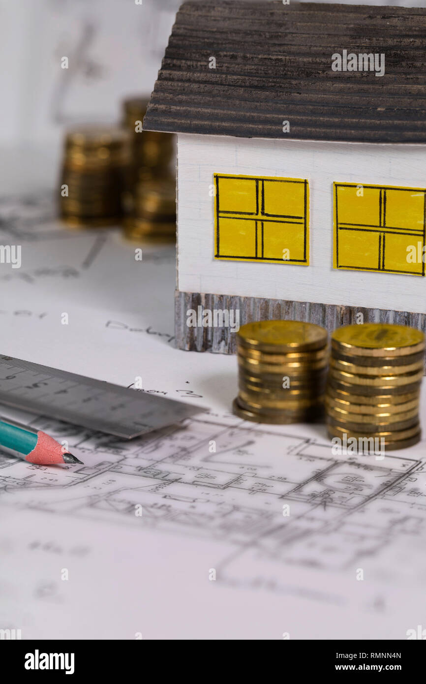 Coal pencil and metal ruler on a technical drawing of an apartment ...
