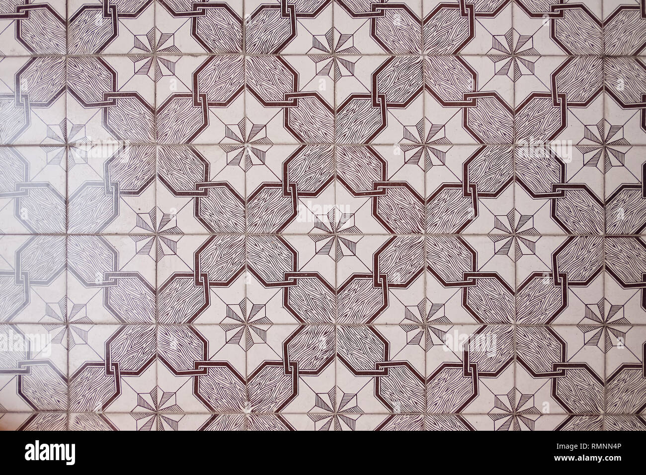 floor of decorative tiles purple triangular patterns Stock Photo - Alamy