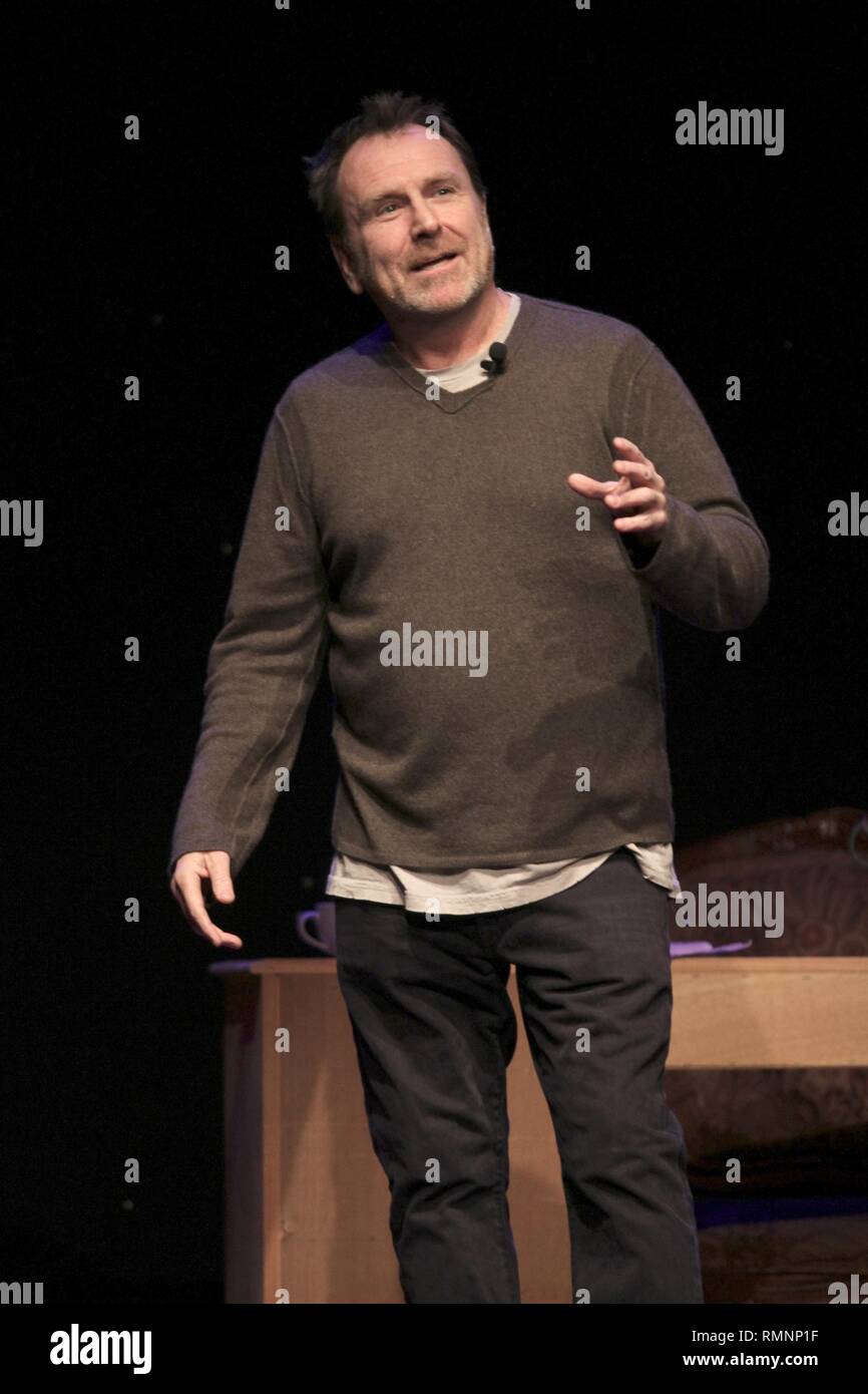 Stand up comedian and writer Colin Quinn is shown performing on stage ...