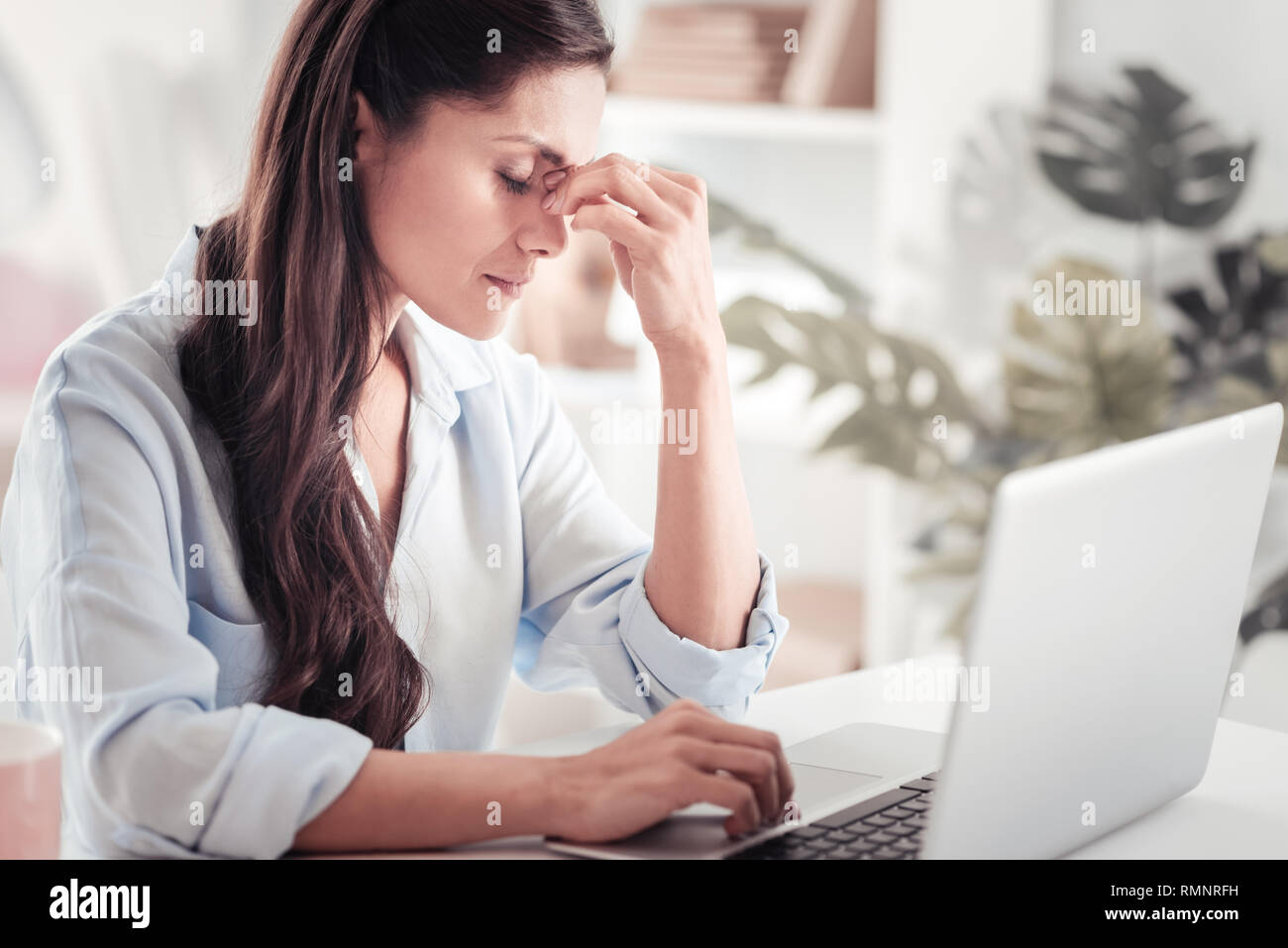 Really tired. Modern successful designer feeling worn out after long ...