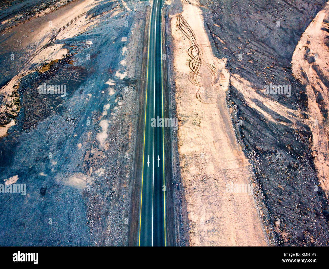 Desert road surrounded by sandstone rocks aerial view Stock Photo - Alamy