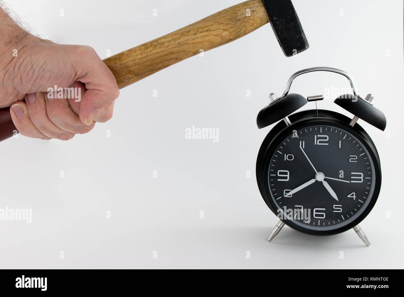 Vintage Alarm Clock with Hammer about to hit on white background Stock ...
