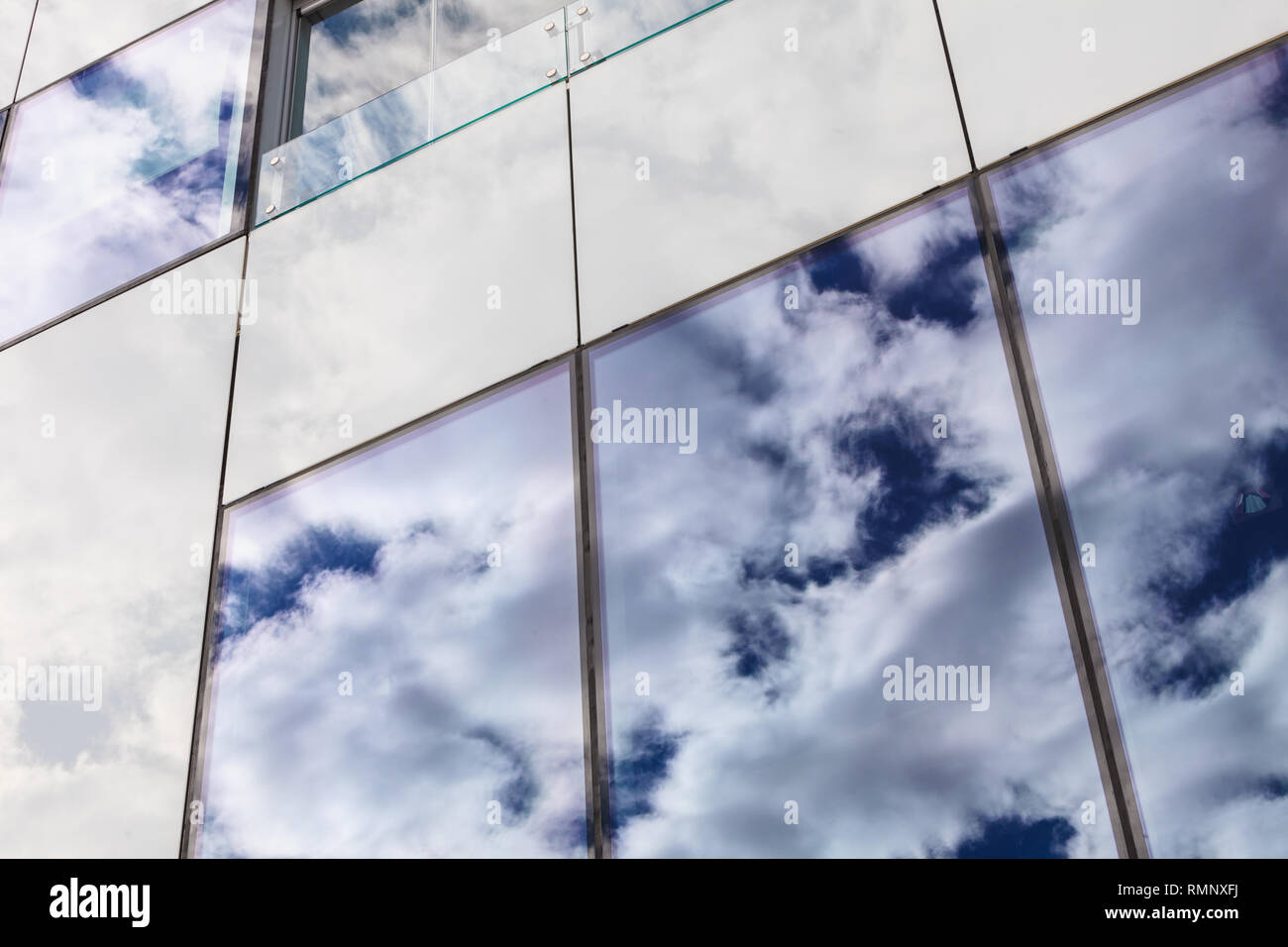 Modern glass window on new building. Undersky skyscrapers rising build ...