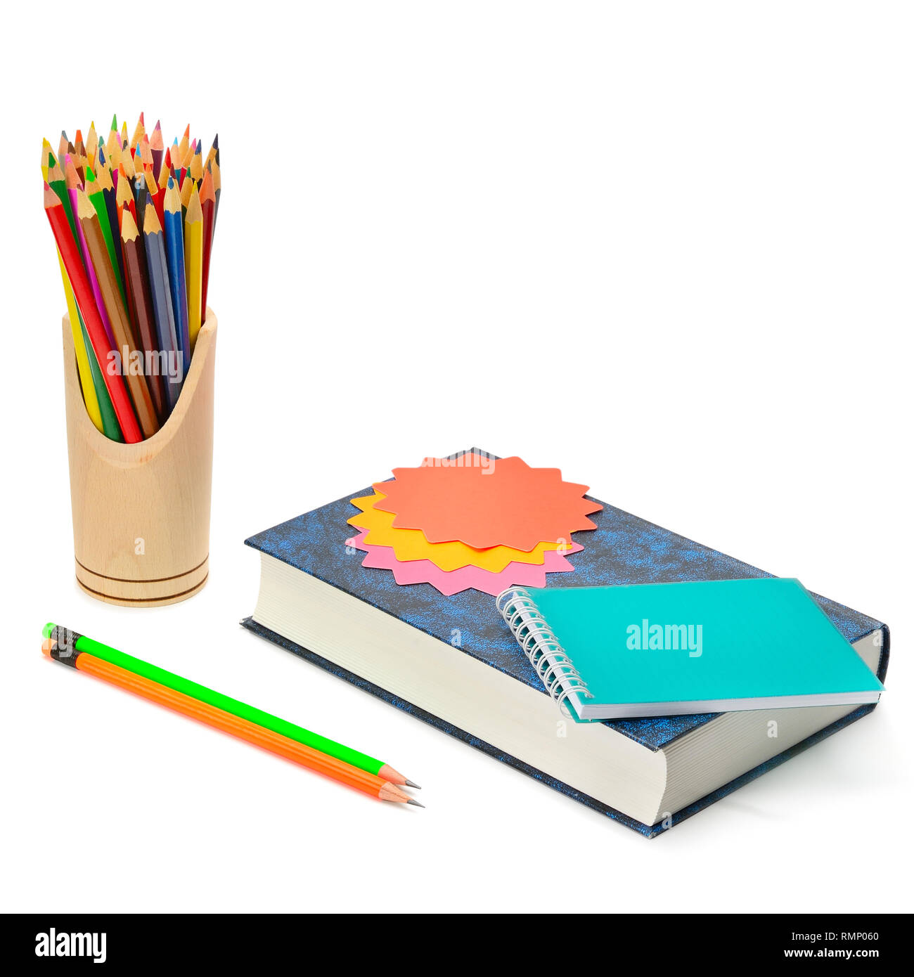 Book , colored pencils and stickers isolated on white background Stock ...