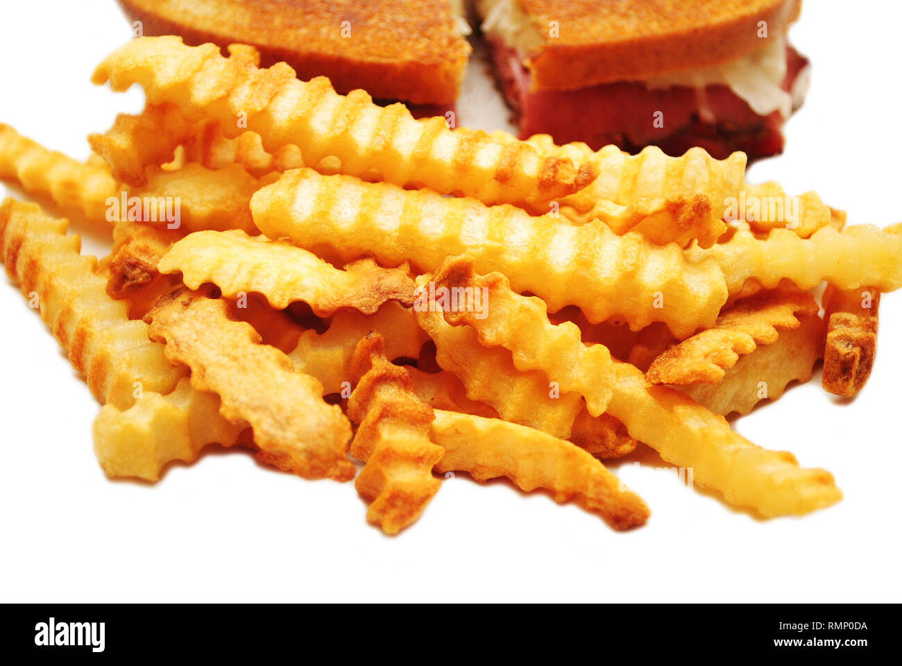 French Fries with a Sandwich in the Background Stock Photo - Alamy