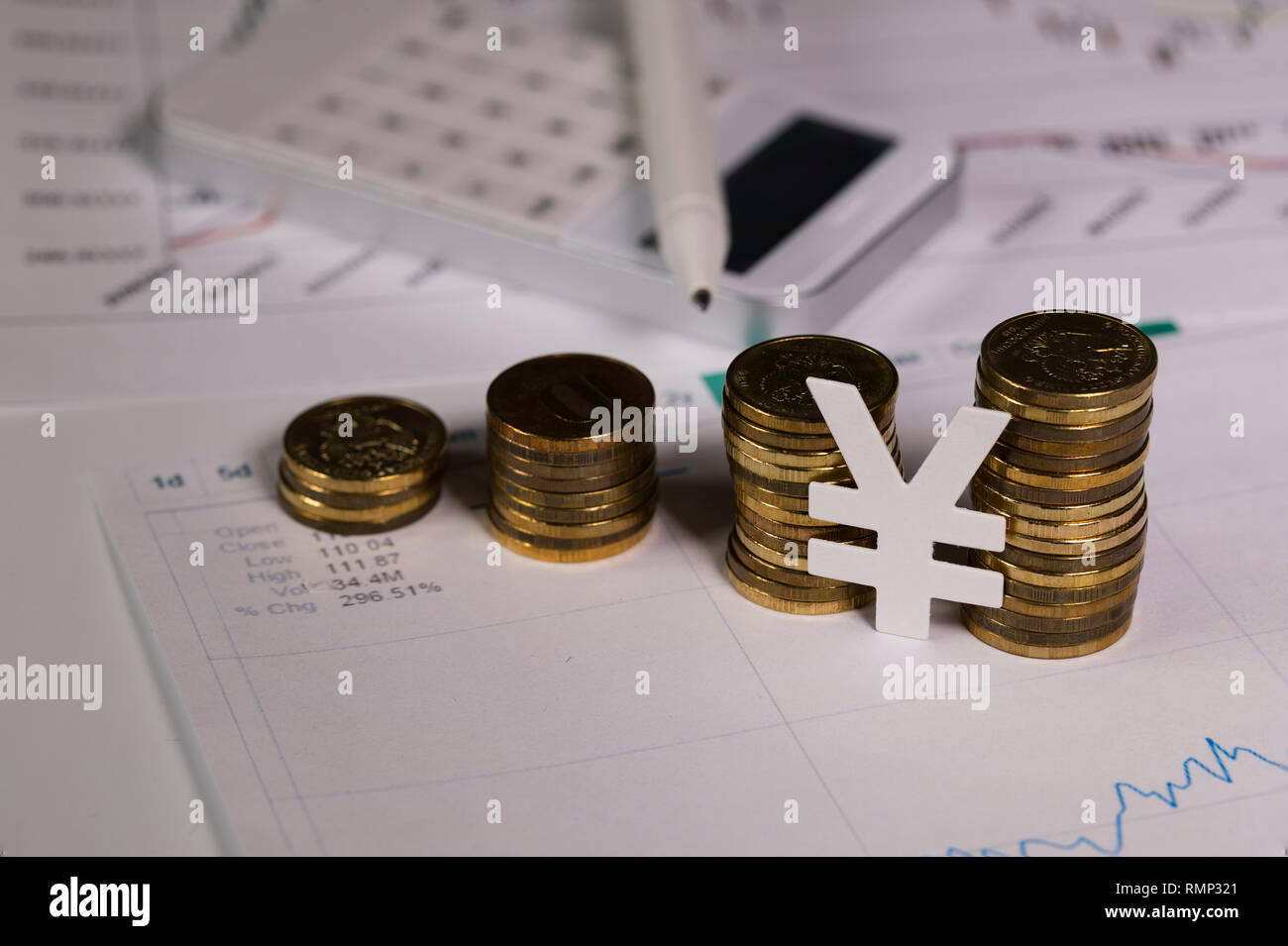 Paper sign of Chinese yuan at stack of Russian 10 roubles coins ...