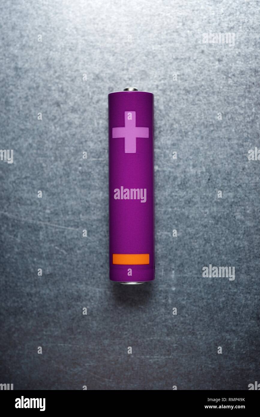 Small battery on a metal table Stock Photo - Alamy