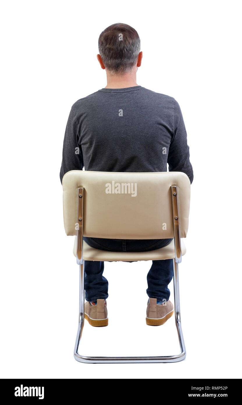 Back view of a man sitting on a chair. Rear view people collection ...
