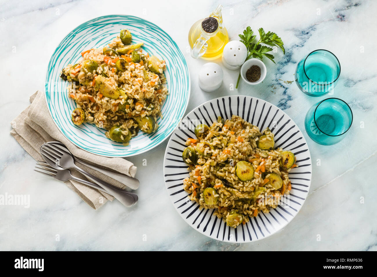 spring risotto on a marble table with spices and olive oil Stock Photo ...