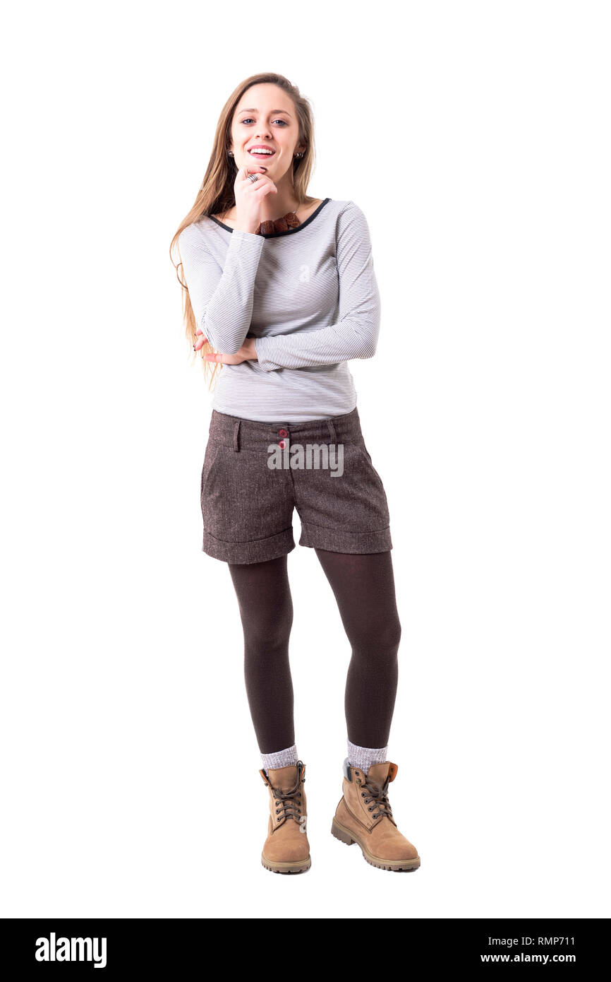 Satisfied young cute woman judging analyzing and smiling with approval ...