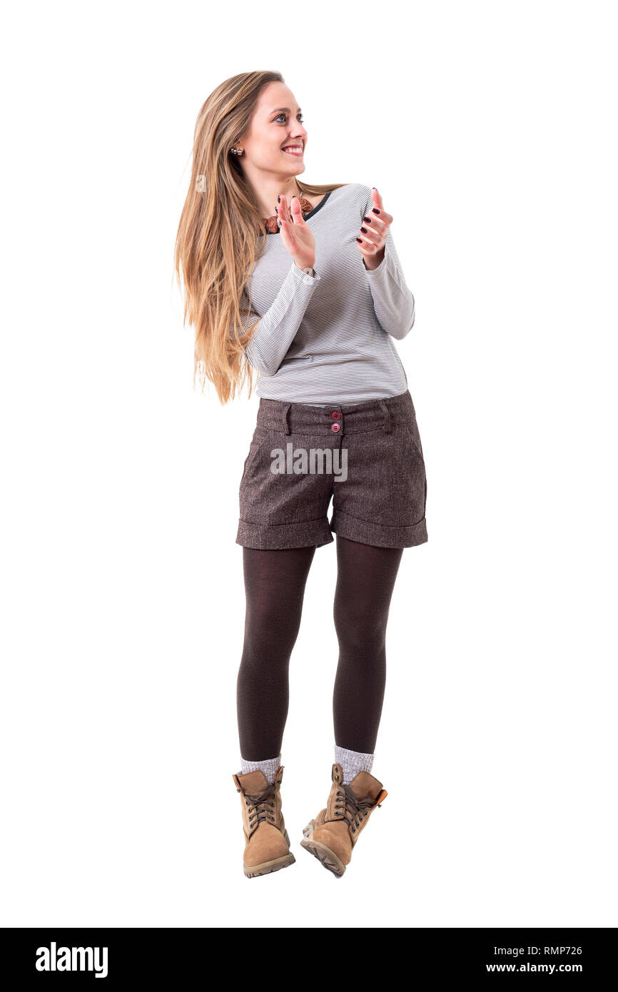 Beautiful young happy woman smiling and clapping hands congratulating ...