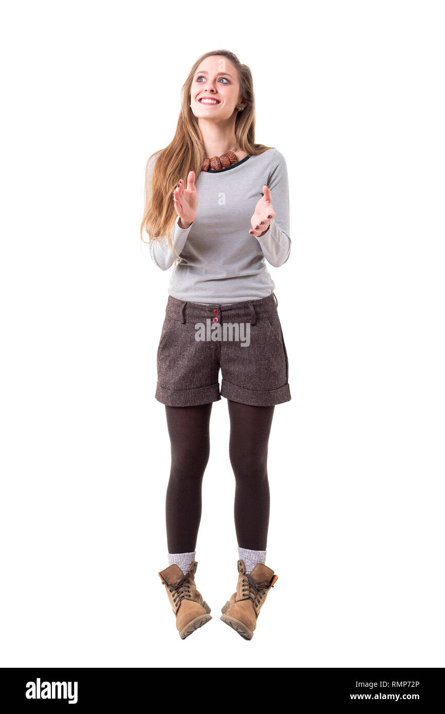 Happy woman standing cheering cute hi-res stock photography and images ...