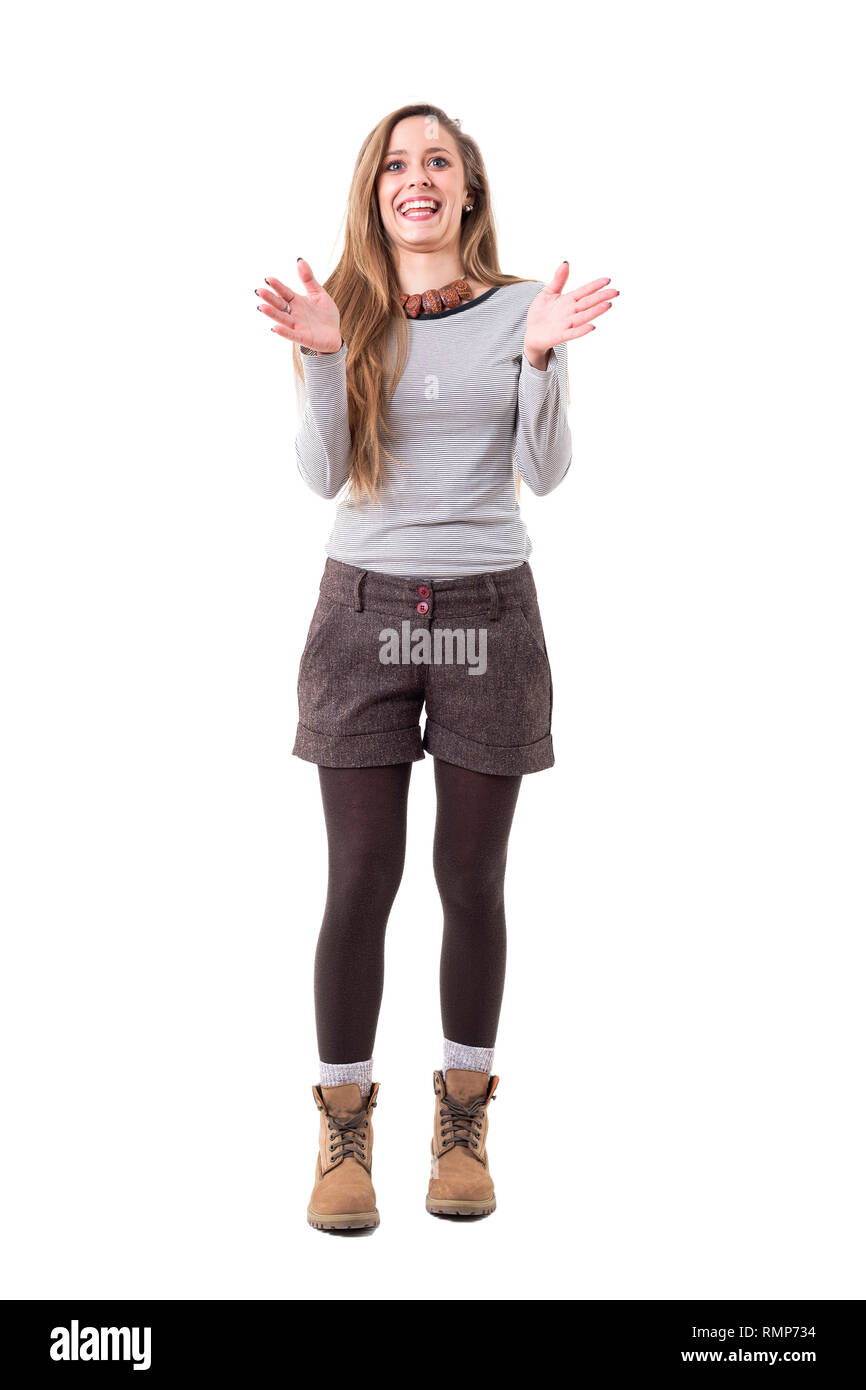 Excited expressive young cute woman smiling and giving standing ...