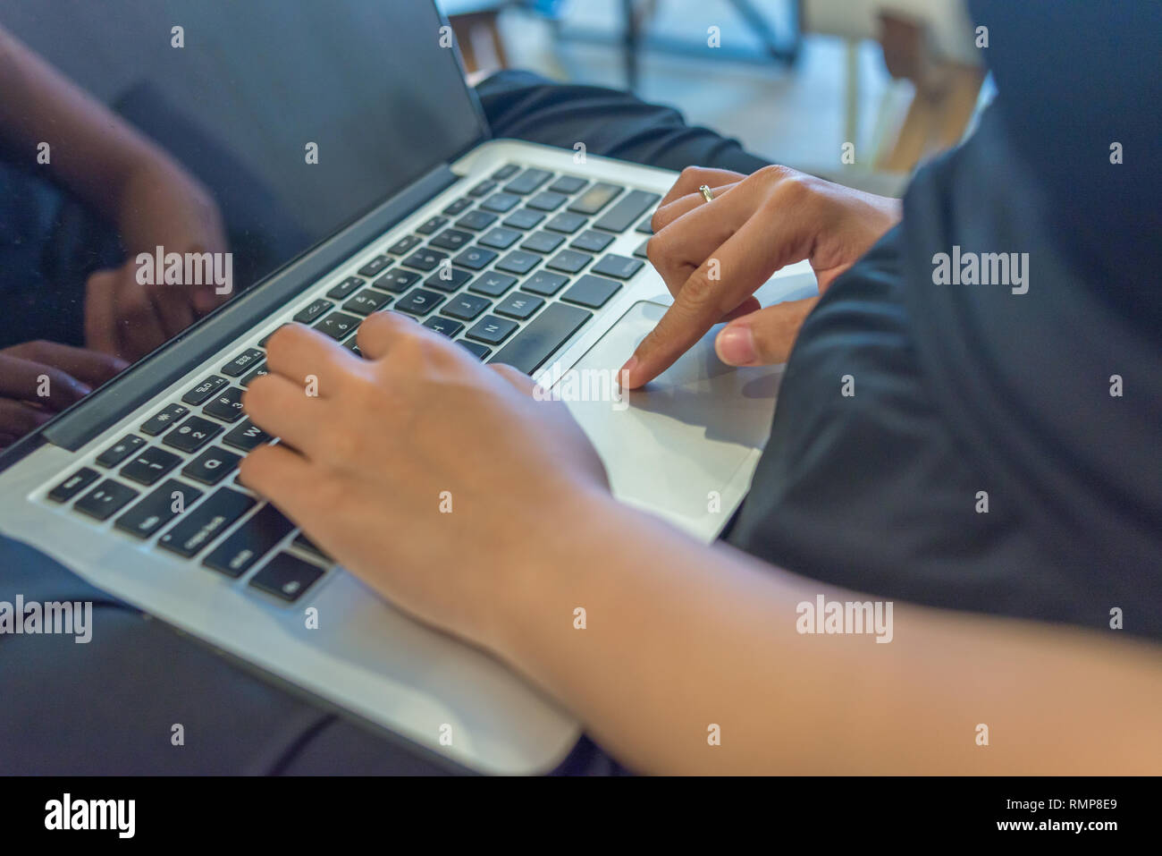 Close up photo of woman hands working on laptop Stock Photo - Alamy